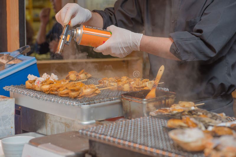 Chefs are Cooking Grilled Shell on the Japan Market. Stock Image ...