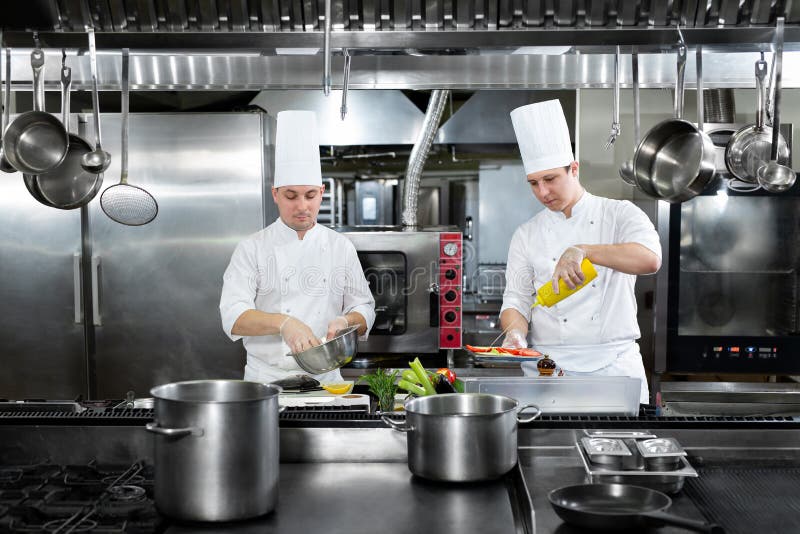 Chefs Prepare Delicious Dishes in the Kitchen Stock Image - Image of ...