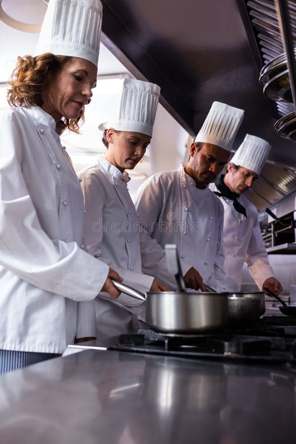 Chefs Preparing Food in Kitchen Stock Image - Image of caucasian, stove ...