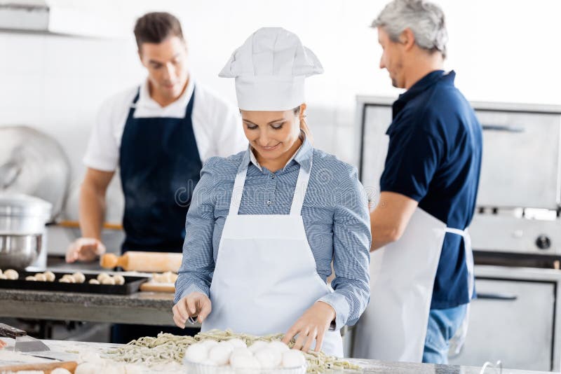 Chefs Preparing Food in Kitchen Stock Photo - Image of communication ...