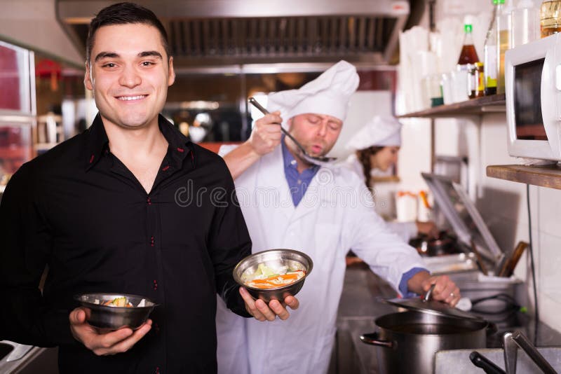 Chefs and Smiling Waiter Working Stock Photo - Image of adult, carry ...