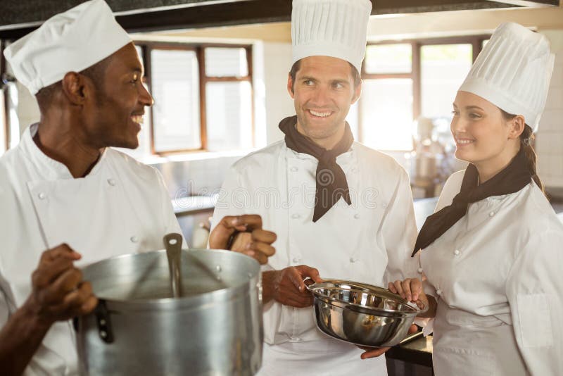 Chefs Talking about What Meal To Prepare for Dinner Service at Fine ...