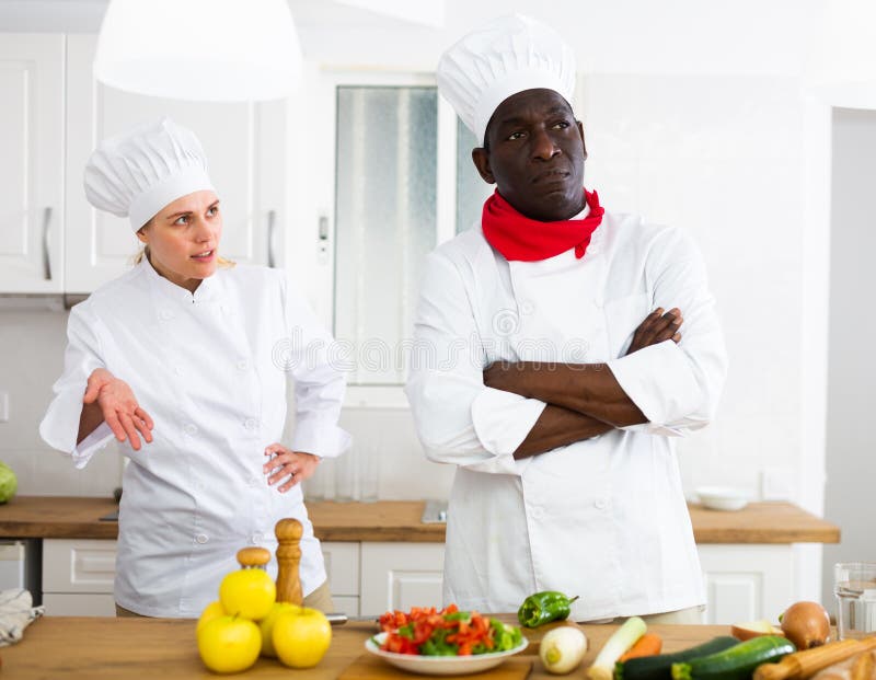 Chefs in White Uniform Having Conflict on Kitchen Stock Photo - Image ...