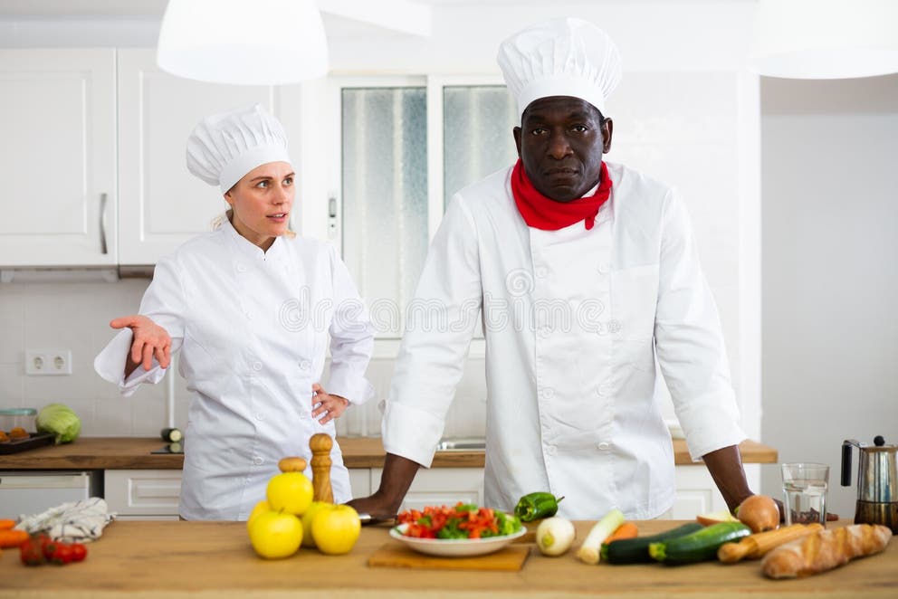 Chefs in White Uniform Having Conflict on Kitchen Stock Photo - Image ...