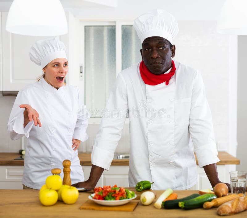 Chefs in White Uniform Having Conflict on Kitchen Stock Photo - Image ...