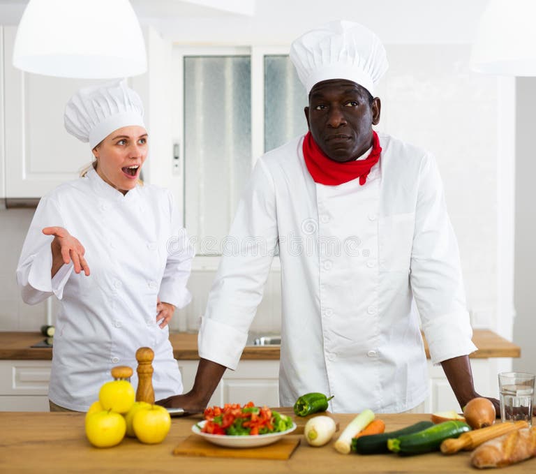 Chefs in White Uniform Having Conflict on Kitchen Stock Photo - Image ...