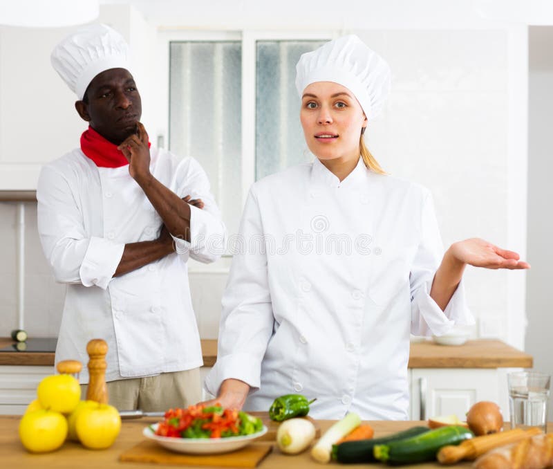Chefs in White Uniform Having Conflict on Kitchen Stock Photo - Image ...