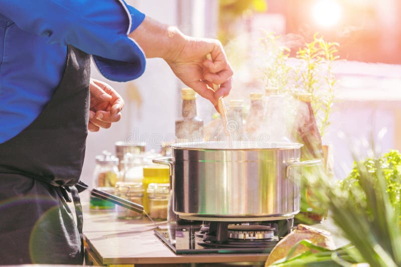 Chefs at Work in a Restaurant Kitchen Making Delicious Food Stock Photo ...