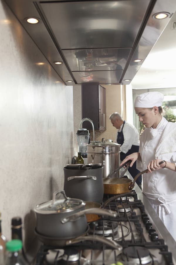 Chefs Working in Commercial Kitchen Stock Image - Image of food ...