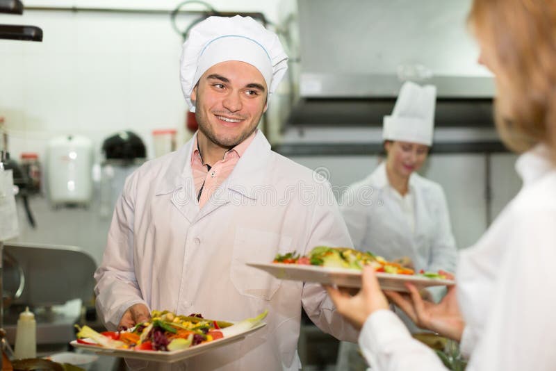 Chefs and young waiter stock photo. Image of cook, food - 48876110