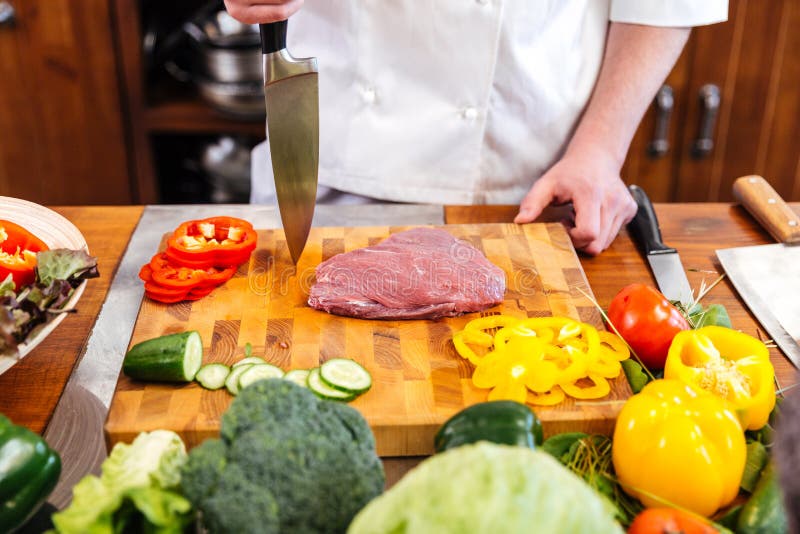 Cheif Cook Coooking Meat and Salad with Fresh Vegetables Stock Image ...