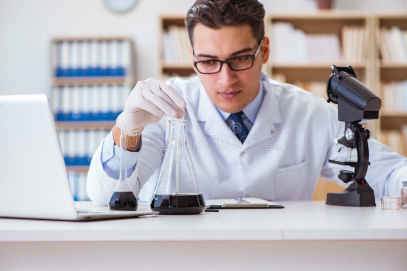 The Chemical Engineer Working on Oil Samples in Lab Stock Photo - Image ...