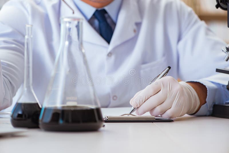 The Chemical Engineer Working on Oil Samples in Lab Stock Photo - Image ...