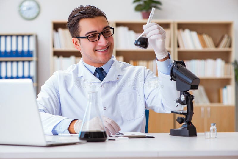 The Chemical Engineer Working on Oil Samples in Lab Stock Photo - Image ...