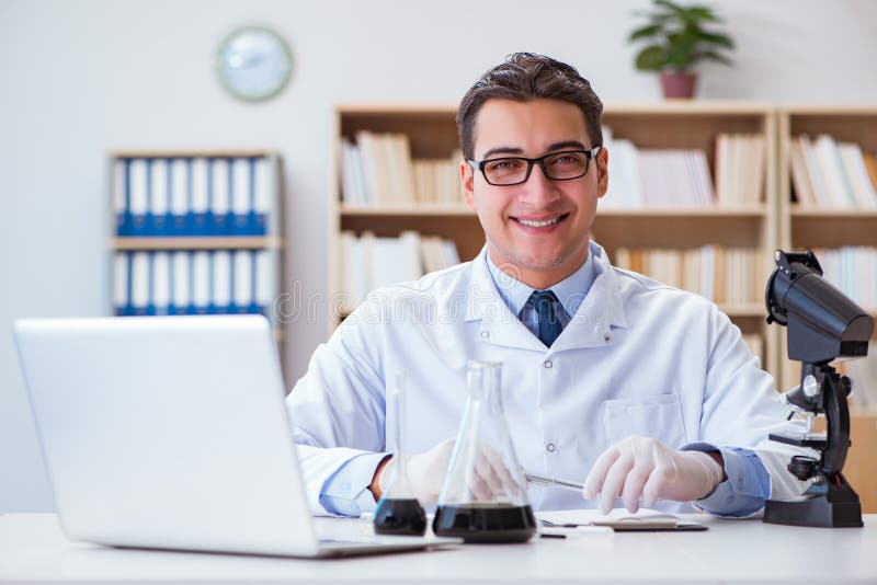 The Chemical Engineer Working on Oil Samples in Lab Stock Photo - Image ...