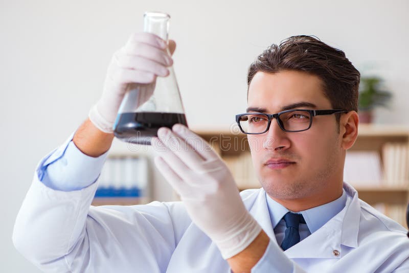 The Chemical Engineer Working on Oil Samples in Lab Stock Photo - Image ...