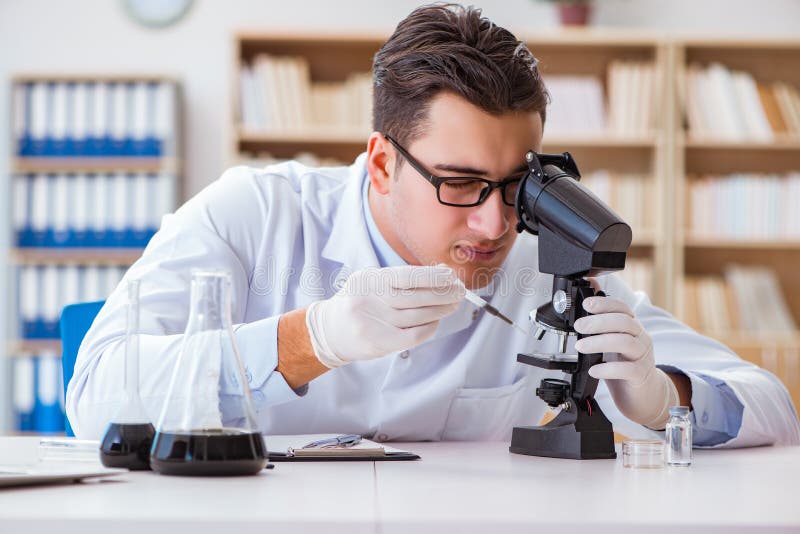 The Chemical Engineer Working on Oil Samples in Lab Stock Photo - Image ...