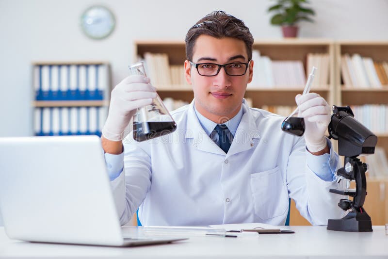 The Chemical Engineer Working on Oil Samples in Lab Stock Photo - Image ...