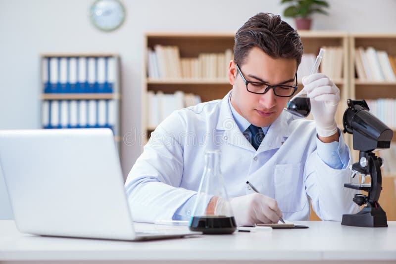 The Chemical Engineer Working on Oil Samples in Lab Stock Photo - Image ...