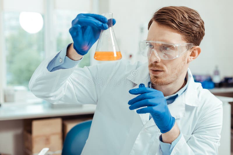Serious Thoughtful Man Looking Liquid Chemical Flask Stock Photos ...