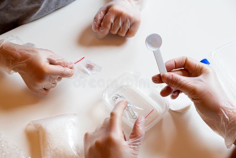 Preparing Chemical, Medical Laboratory Equipments on the White Table ...