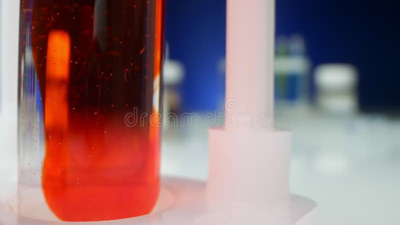 Chemical Experiments. Red Liquid Dissolves in a Clear Liquid in a Test ...