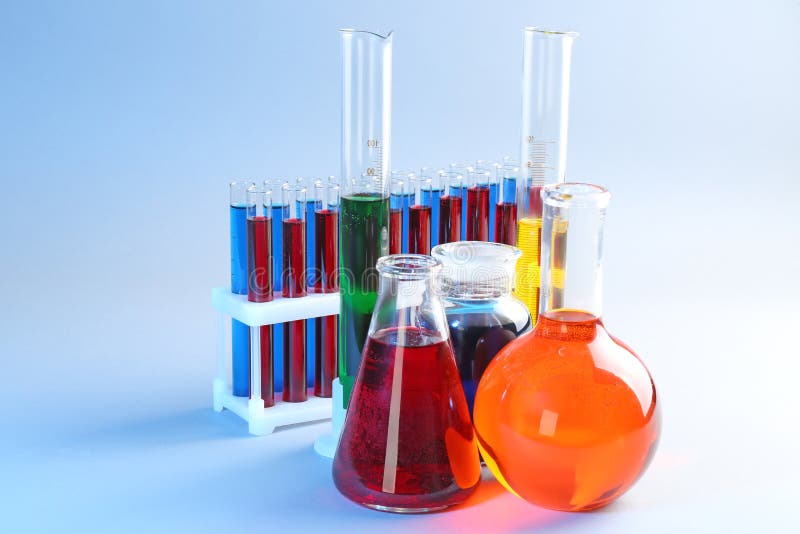 Chemical Glassware with Different Liquids on Color Background Stock ...