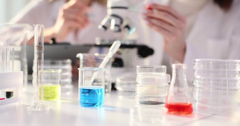 Chemical Laboratory Experiment with Liquids and Microscope Stock Video ...