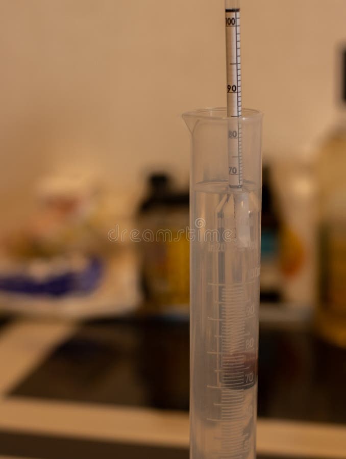 Measuring Alcohol with a Thermometer Stock Photo - Image of spirit ...
