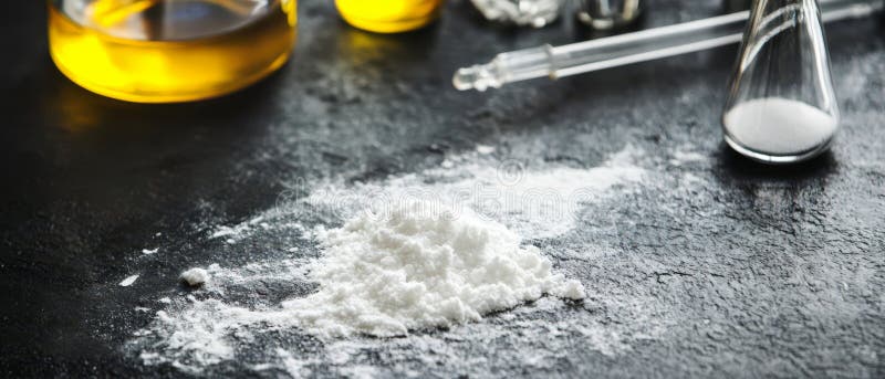 Chemical Substances and Laboratory Equipment Arranged on a Dark Surface ...