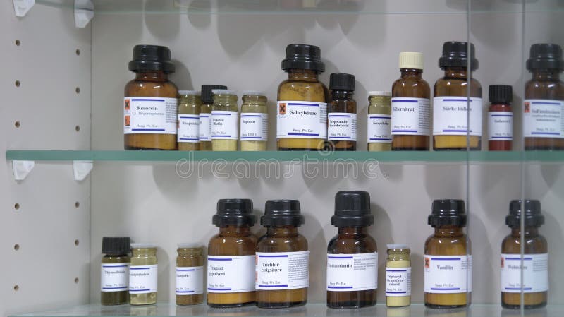 Chemicals in glass bottles stock image. Image of science - 25217367