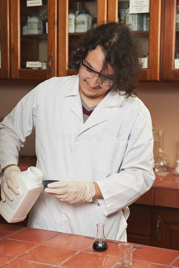 Chemist adding reagent stock photo. Image of chemist - 71155062