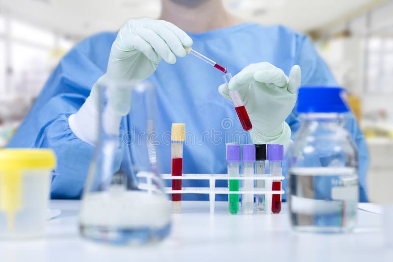 Chemist Analyzing Liquid Samples in a Laboratory Stock Image - Image of ...