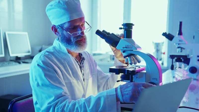 Chemist Analyzing Samples with Modern Equipment in Research Laboratory ...