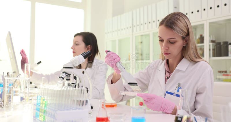 Chemist Biologist Laboratory Assistant Pours Liquid Onto Tray Using ...