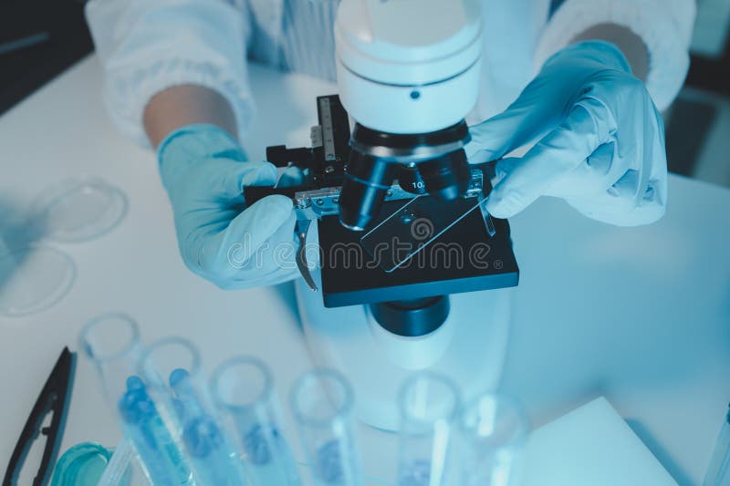 Chemist is Doing an Experiment in the Laboratory, a Scientist is Using ...