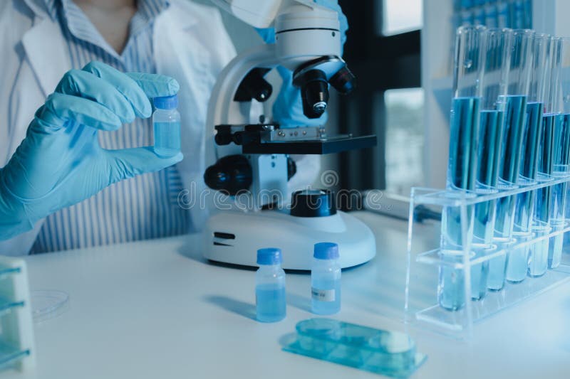 Chemist is Doing an Experiment in the Laboratory, a Scientist is Using ...