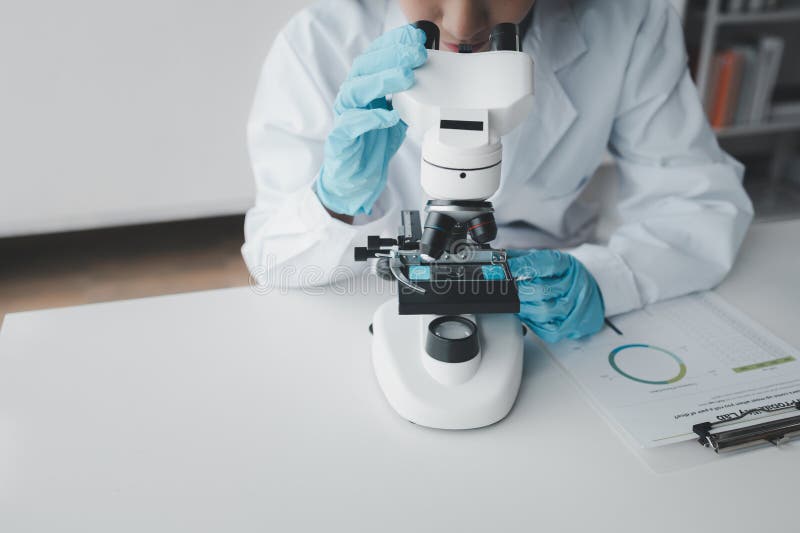 Chemist is Doing an Experiment in the Laboratory, a Scientist is Using ...