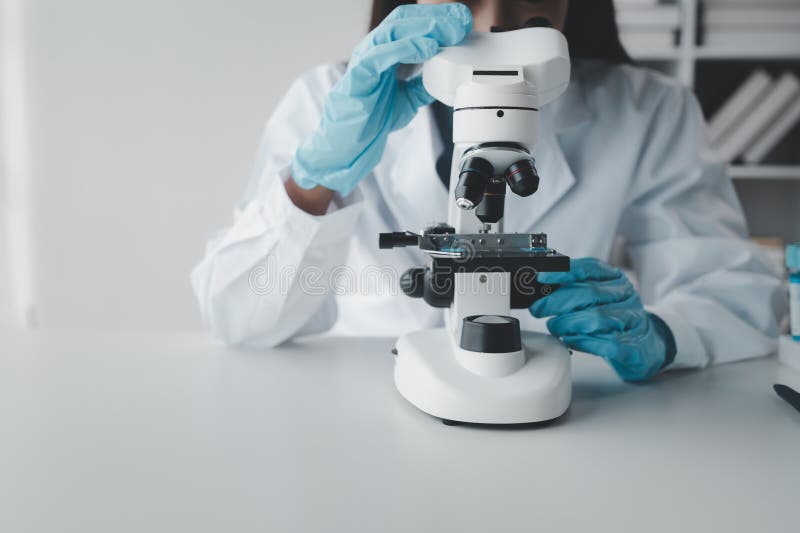 Chemist is Doing an Experiment in the Laboratory, a Scientist is Using ...