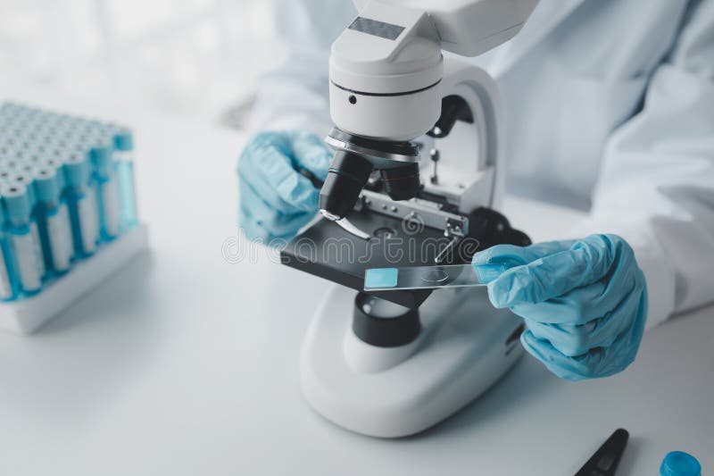 Chemist is Doing an Experiment in the Laboratory, a Scientist is Using ...