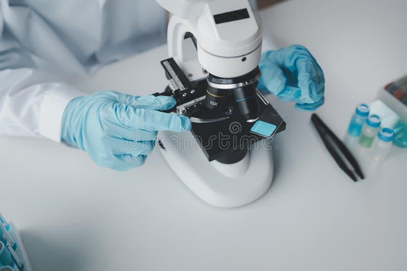 Chemist is Doing an Experiment in the Laboratory, a Scientist is Using ...