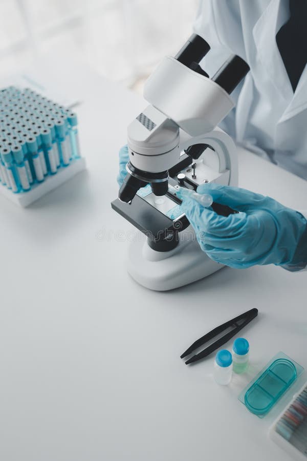 Chemist is Doing an Experiment in the Laboratory, a Scientist is Using ...