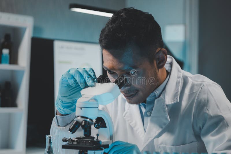 Chemist is Doing an Experiment in the Laboratory, a Scientist is Using ...