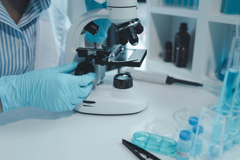 Chemist is Doing an Experiment in the Laboratory, a Scientist is Using ...