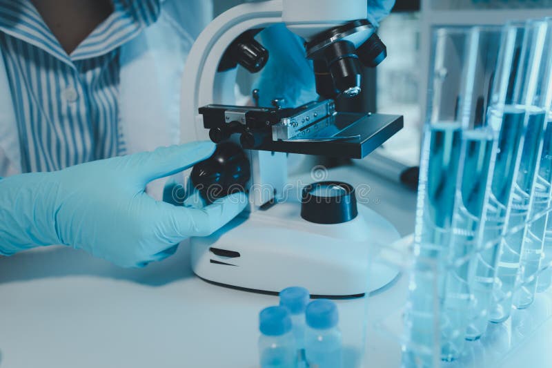 Chemist is Doing an Experiment in the Laboratory, a Scientist is Using ...