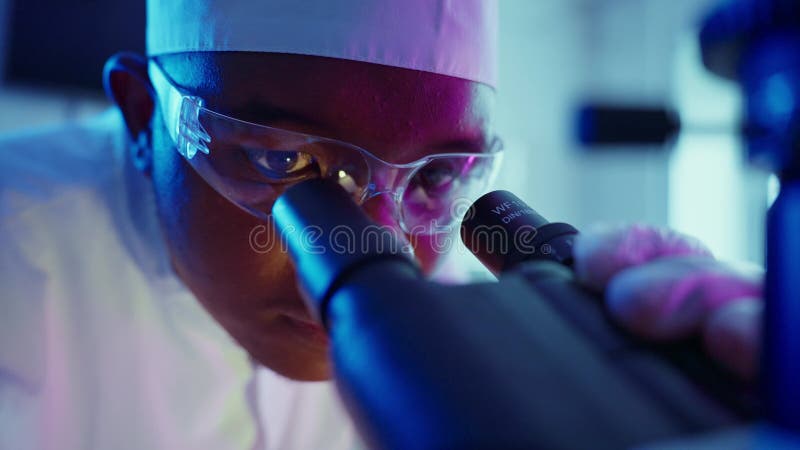 Research Chemist Analyzing Chemical Samples in Neon-lit Laboratory ...