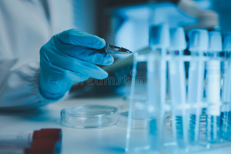 A Chemist Examines a Sample of a Liquid in a Laboratory, a Laboratory ...
