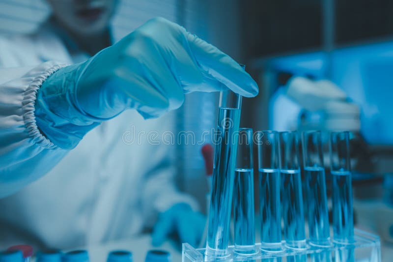 A Chemist Examines a Sample of a Liquid in a Laboratory, a Laboratory ...