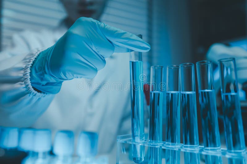 A Chemist Examines a Sample of a Liquid in a Laboratory, a Laboratory ...