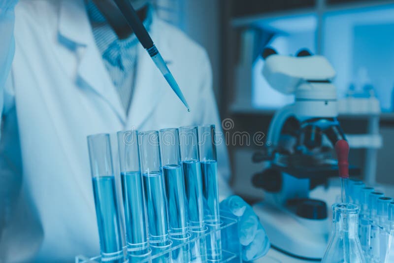 A Chemist Examines a Sample of a Liquid in a Laboratory, a Laboratory ...
